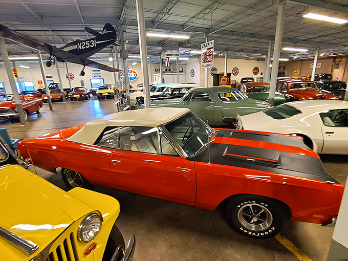 Muscle car heaven! This 1969 Plymouth Road Runner's vibrant orange-red paint job screams "speed" even while perfectly still. The automotive equivalent of a rebel yell.