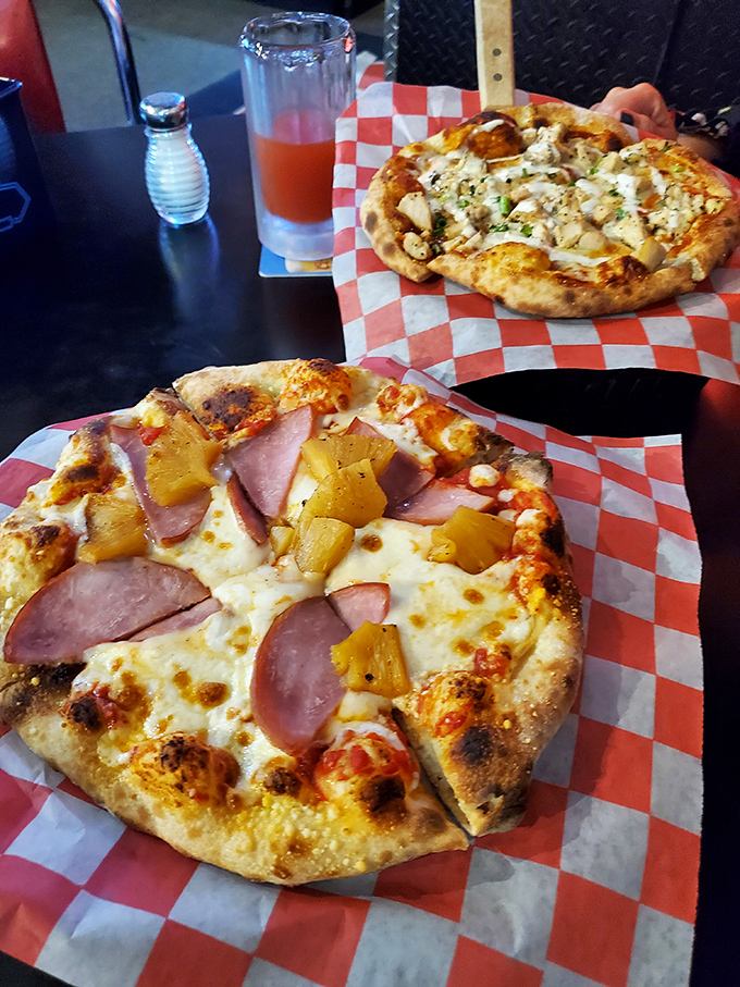 Two personal pizzas, endless possibilities&mdash;one classic ham and pineapple, one specialty creation, both making a strong case for Kitty's unexpected pizza prowess.