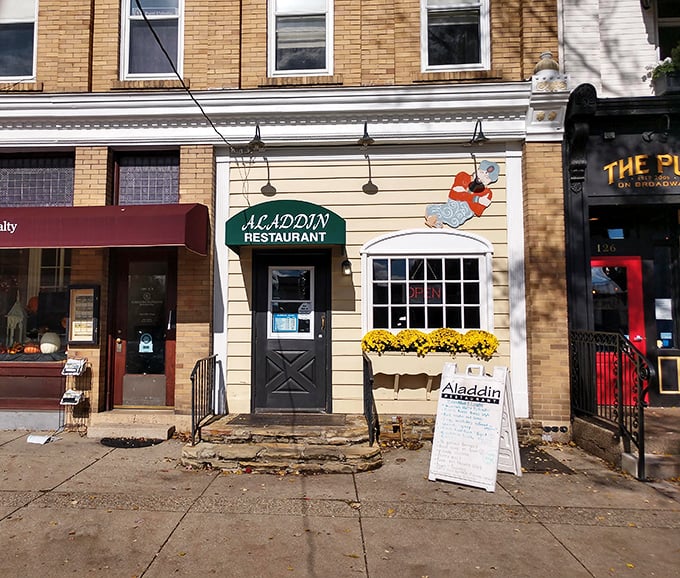 Aladdin Restaurant's charming facade promises comfort food with character. That sandwich board menu changes with the seasons, but the welcome never does.