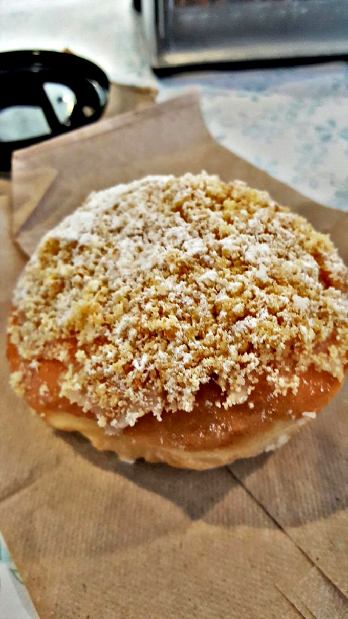 The crumb topping that launched a thousand cravings. This donut wears its streusel crown with the confidence of royalty.