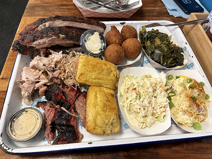 A barbecue spread that would make vegetarians reconsider their life choices. That smoke ring is practically a halo.