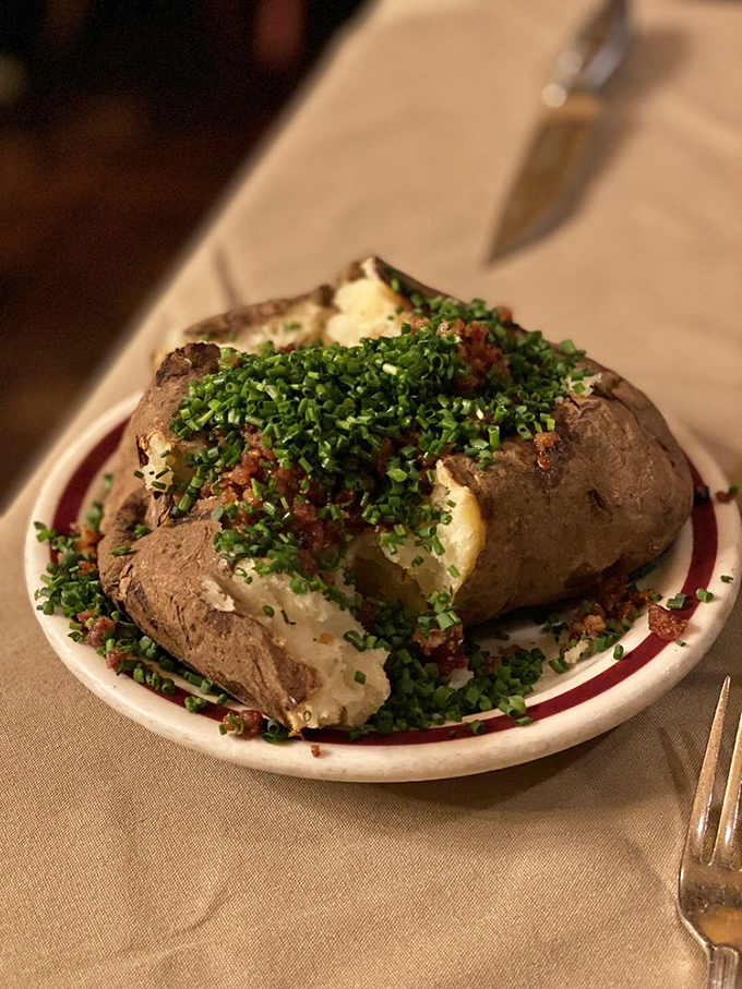 A baked potato that's dressed better than most people at dinner &ndash; loaded with all the fixings and ready for its close-up.