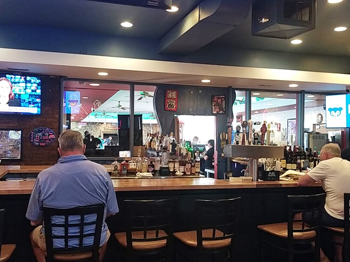 A bar where strangers become friends over stories and spirits. The kind of place where "just one more" feels like the right decision.