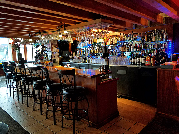This well-stocked bar and its warm wooden ceiling provide you with an inviting spot to sip your favorite evening cocktail.