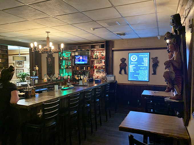 This isn't just a bar&mdash;it's command central for cocktail crafting and pre-dinner anticipation. Those cowboy figures stand guard over liquid happiness. 