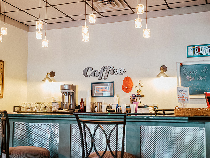 The coffee station stands ready for duty, its "Coffee" sign unnecessary but appreciated. In a diner, coffee isn't just a beverage&mdash;it's a constitutional right.