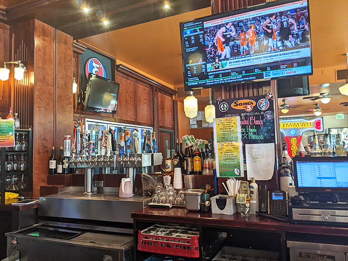 The bar area proves Sam's isn't just for breakfast&mdash;it's an all-day affair where sports on TV meet spirits in glasses.