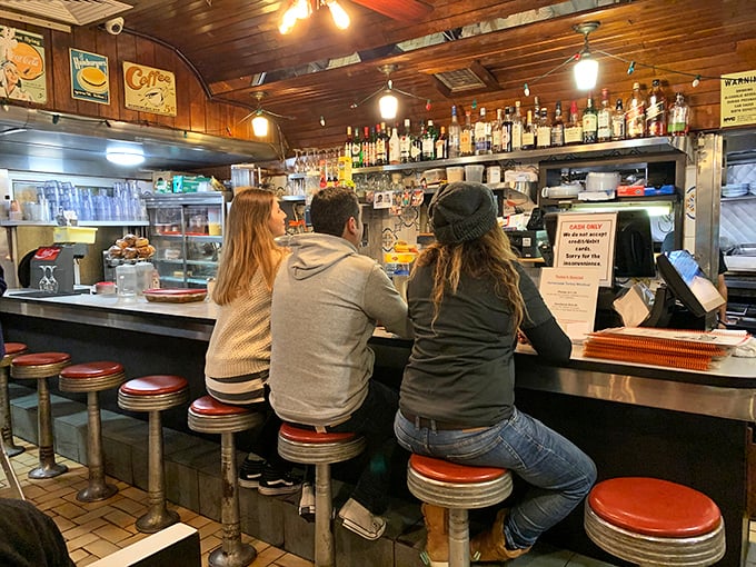 The counter seats&mdash;where solo diners become regulars, and the breakfast ballet unfolds before your eyes with practiced precision.