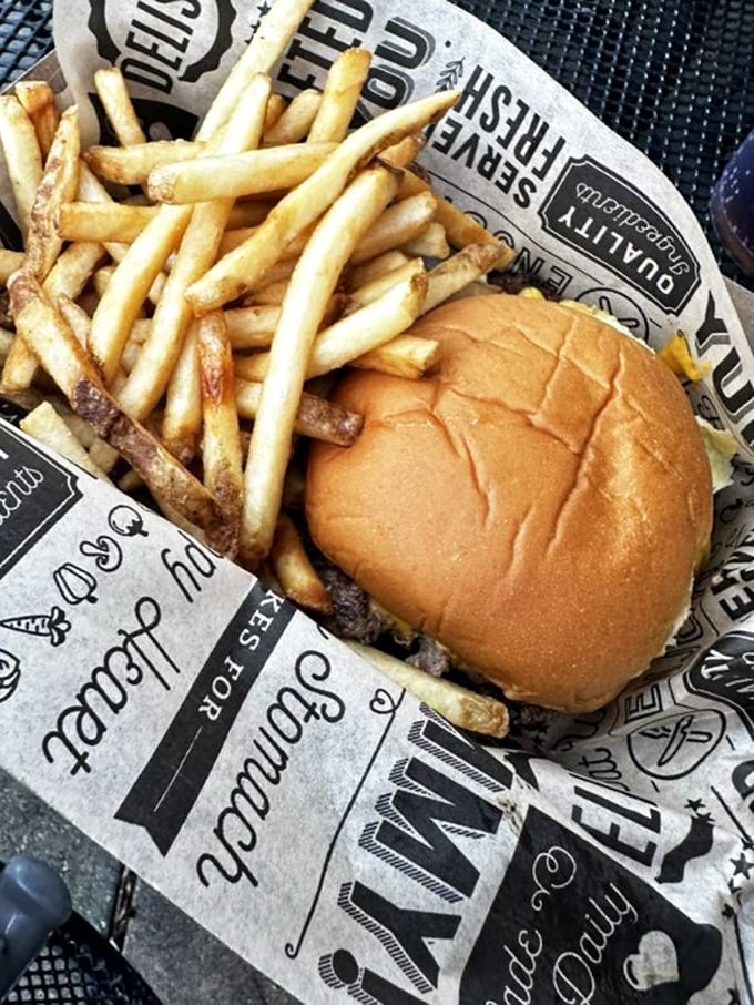 The perfect ratio of burger to fries&mdash;a mathematical equation that equals pure happiness on a wooden table.