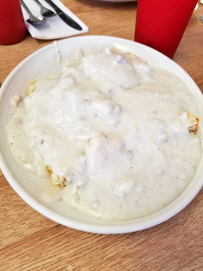 Biscuits swimming in creamy sausage gravy&mdash;not so much a side dish as it is a life philosophy in a bowl.
