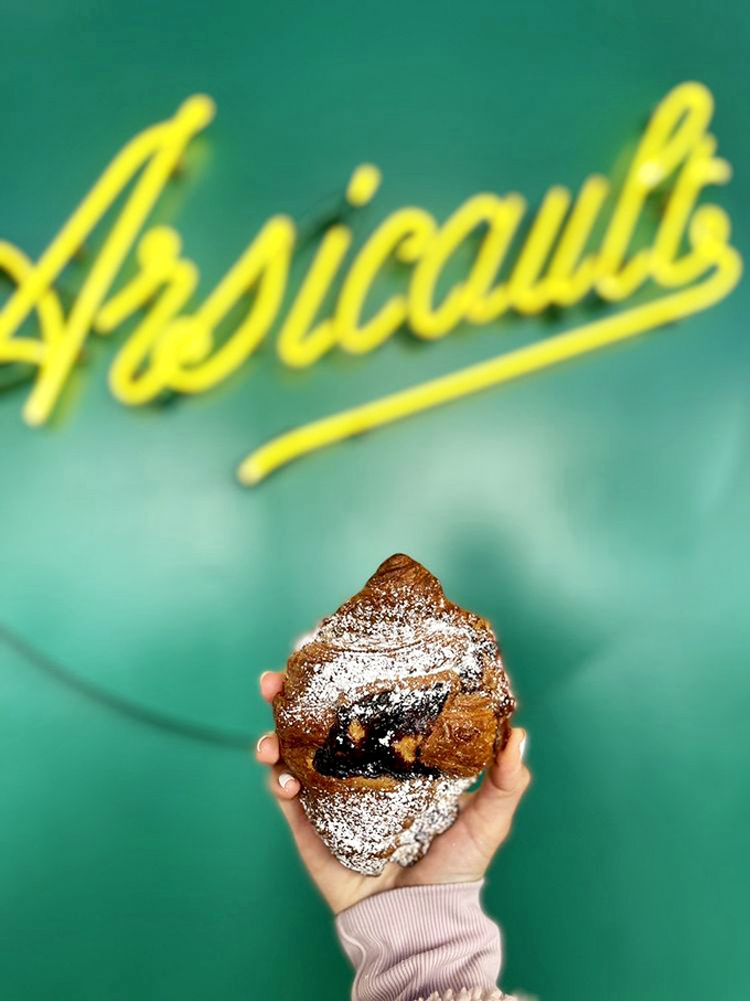 This isn't just a pastry; it's a statement piece. The blackberry almond croissant dressed in its finest powdered attire for your breakfast table.