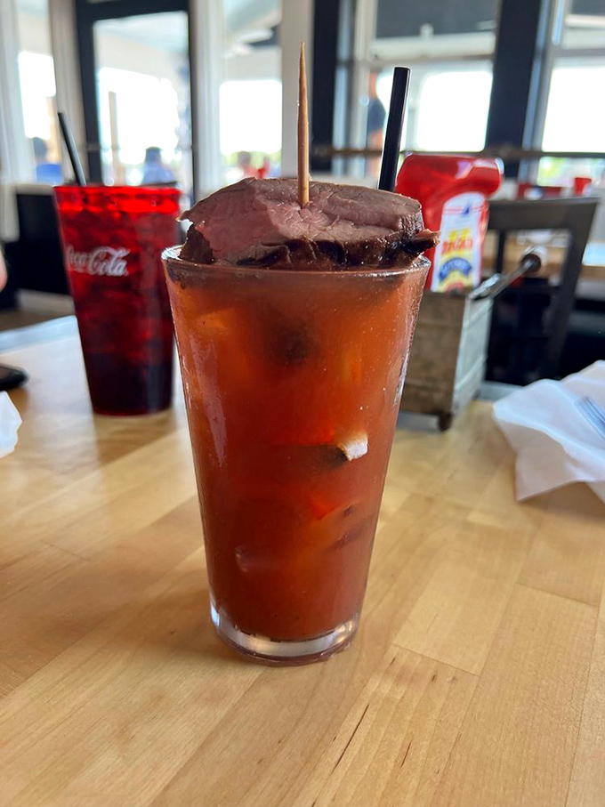 A Bloody Mary with ambition – sporting a roast beef garnish that's more like a bonus sandwich than a simple cocktail accessory.