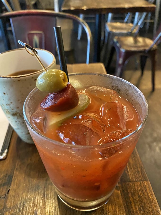 A proper Bloody Mary garnished with olive and sausage&mdash;because sometimes breakfast should come with a kick.