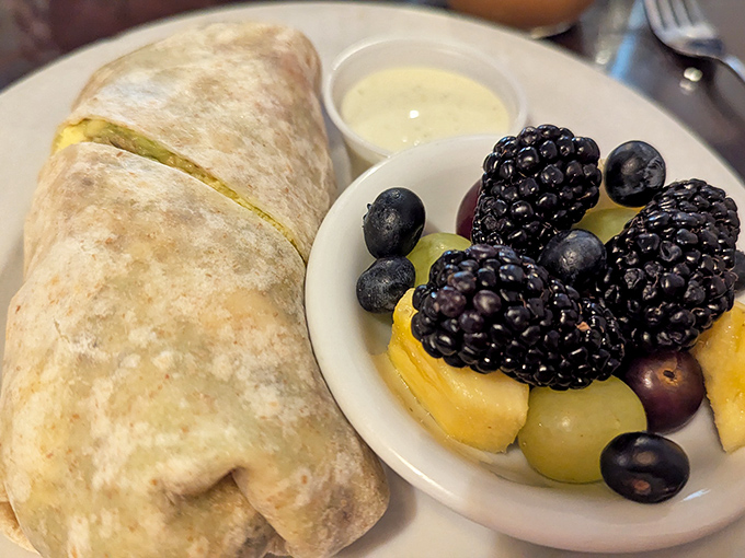 This breakfast burrito doesn't just feed you&mdash;it hugs your soul. Fresh berries on the side keep things civilized, but just barely.
