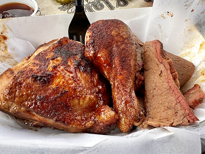 The holy trinity of barbecue&mdash;chicken, brisket, and ribs&mdash;united on one tray like delicious superheroes.