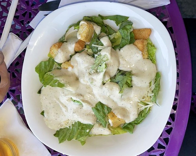 "This vibrant green booth is like stepping into your eccentric aunt's attic—if your aunt had impeccable taste in vintage collectibles."