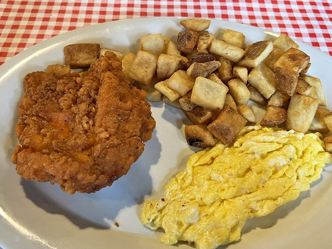 The holy trinity of Southern breakfast&mdash;crispy fried chicken, perfectly cooked eggs, and golden home fries that make waking up early seem like a brilliant idea.