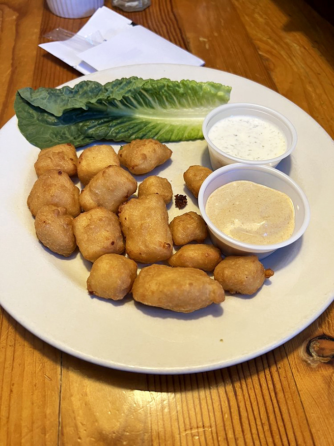 These aren't just cheese curds&mdash;they're little golden nuggets of happiness. Crispy outside, gooey inside, with dipping sauces that elevate the experience.
