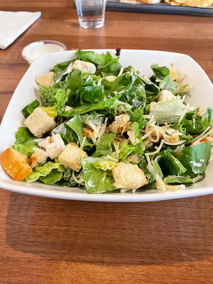 When a Caesar salad has this much personality—fresh greens, homemade croutons, and properly dressed without drowning—lunch becomes an event worth showing up for.