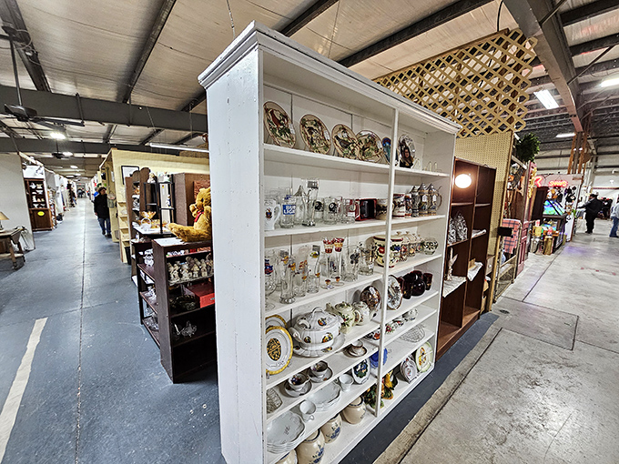 This pristine white cabinet showcases the fine china that's waiting for your next dinner party. Downton Abbey elegance at yard sale prices.