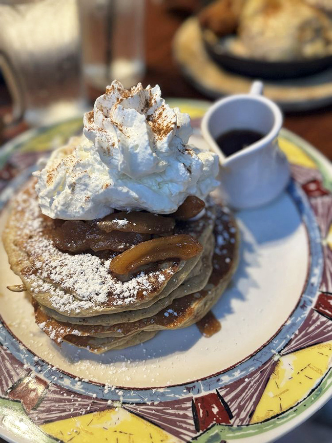 Pancakes topped with a cloud of whipped cream that's practically applying for statehood. Breakfast or dessert? Yes, please.