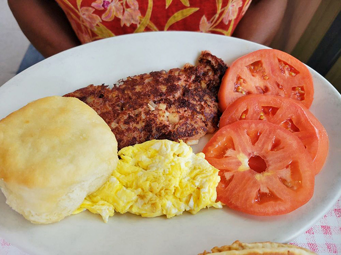A plate that screams "America!"&mdash;golden biscuit, fluffy eggs, and country ham with tomatoes pretending to make it healthy.
