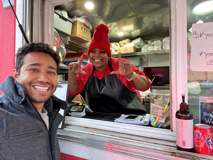 The service window where dreams come true and diet plans go to die, all with a smile that's as warm as the food.