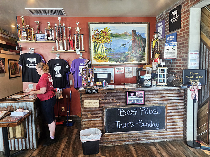 The trophy shelf tells stories of barbecue battles won, while the chalkboard announces when those coveted beef ribs make their weekly appearance&mdash;mark your calendars accordingly.