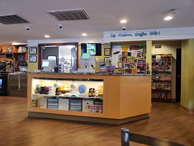 "Life Happens, Waffles Help!" - a philosophy we should all adopt, displayed proudly above a counter where breakfast dreams are dispatched.