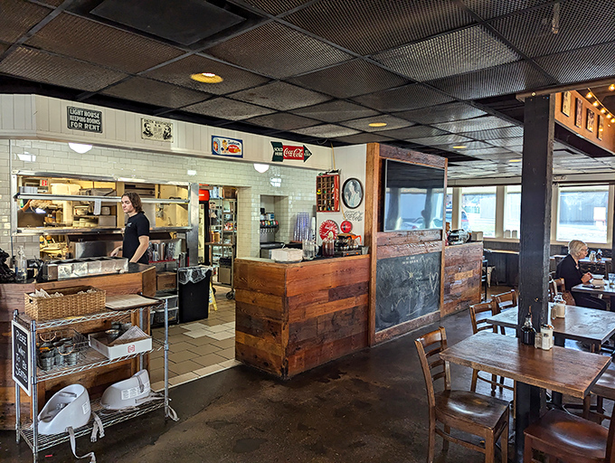 Where the magic happens &ndash; the open kitchen and wooden counter area invite diners to witness the choreography of comfort food creation.