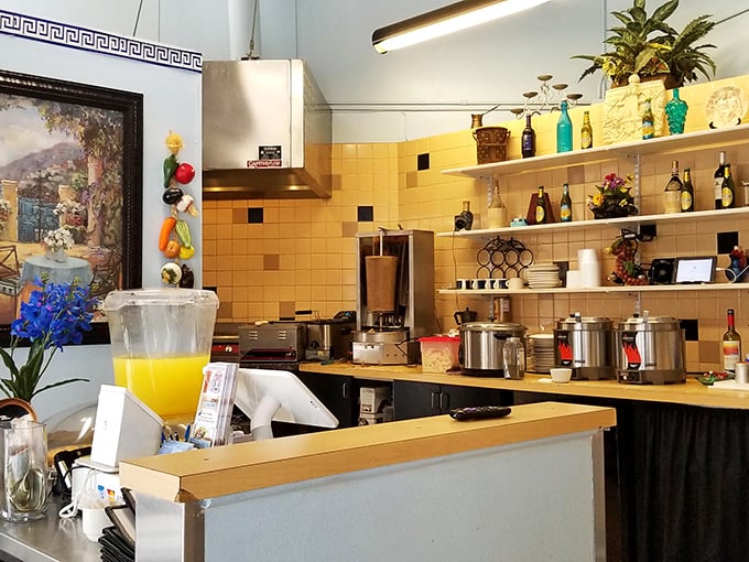 The open kitchen area offers a glimpse behind the culinary curtain, where Mediterranean magic happens daily.