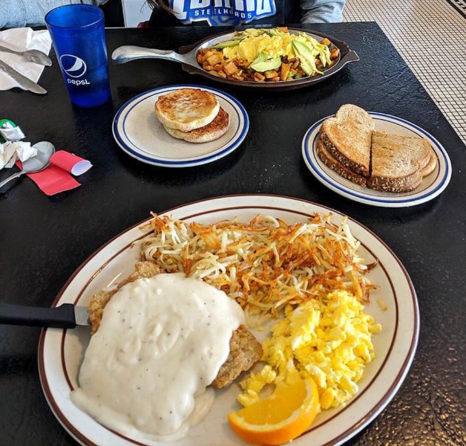 Country fried steak smothered in gravy alongside golden hash browns &ndash; the kind of breakfast that fuels Idaho's farmers and keeps cardiologists in business.
