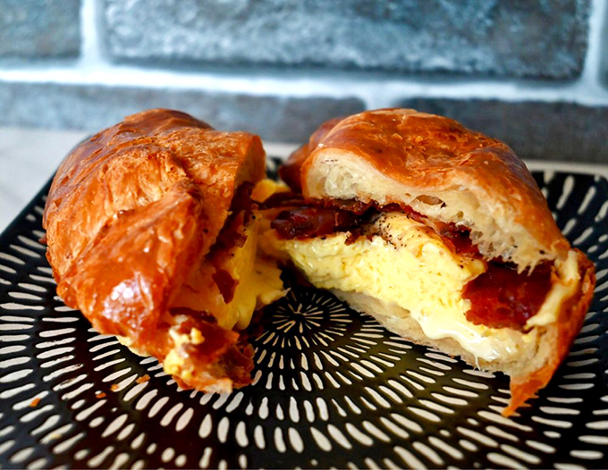 The croissant breakfast sandwich &ndash; where buttery French pastry meets all-American breakfast in a cross-cultural masterpiece.