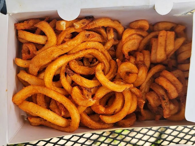 These curly fries aren't just side dishes &ndash; they're spiralized potato masterpieces. Each twist holds the perfect amount of seasoning, like edible flavor springs.