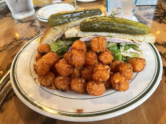 The sandwich-and-tots combo that makes lunch feel like playing hooky from adulting, even if you're on your lunch break.