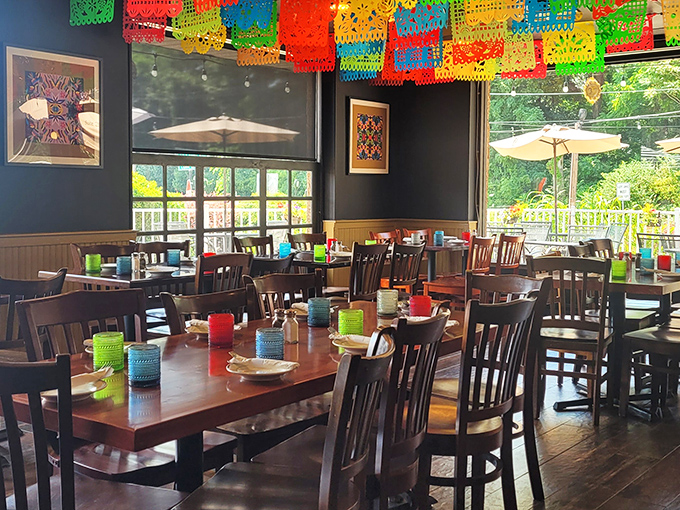 Papel picado banners add bursts of color overhead, like a permanent fiesta waiting to celebrate your wise menu choices.