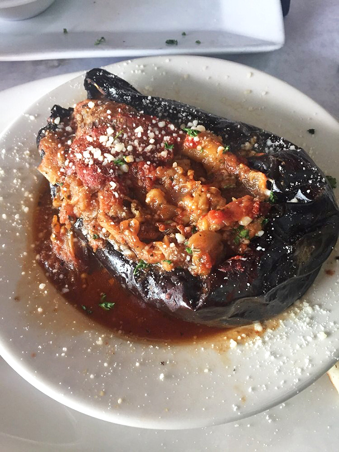 This stuffed eggplant isn't just food&mdash;it's edible architecture, layered with flavors that would make any Greek grandmother nod in silent approval.