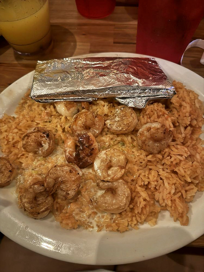 When shrimp this perfectly grilled meets seasoned rice, it's not just dinner&mdash;it's the seafood romance story you didn't know you needed.