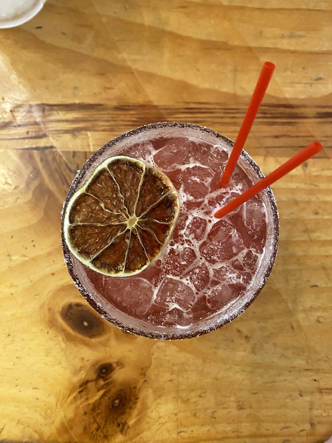 This isn't just a cocktail; it's a sunset in a glass, rimmed with promise and garnished with the perfect excuse to linger.