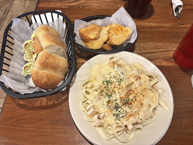 Fettuccine Alfredo with garlic bread on standby. In Arkansas or Italy, there's something universal about the appeal of pasta draped in creamy sauce.