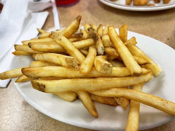 French fries&mdash;the reliable sidekick to seafood that never steals the show but always delivers exactly what you need.