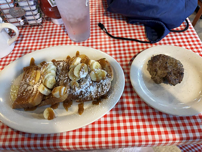 French toast topped with bananas, powdered sugar, and enough syrup to make your pancreas write you a strongly worded letter.