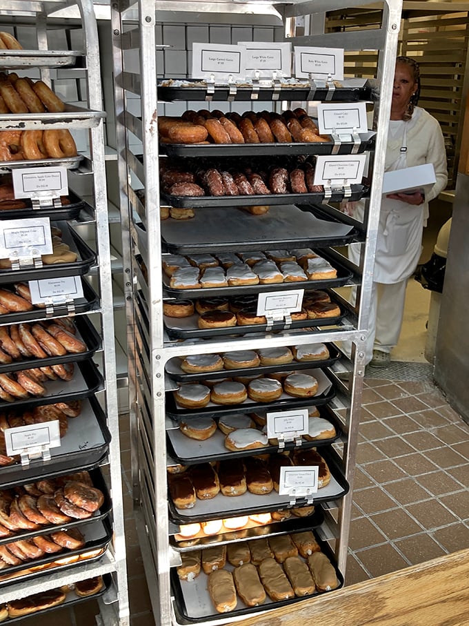 Behind-the-scenes magic captured! Fresh trays of donuts waiting their turn to make someone's day exponentially better.