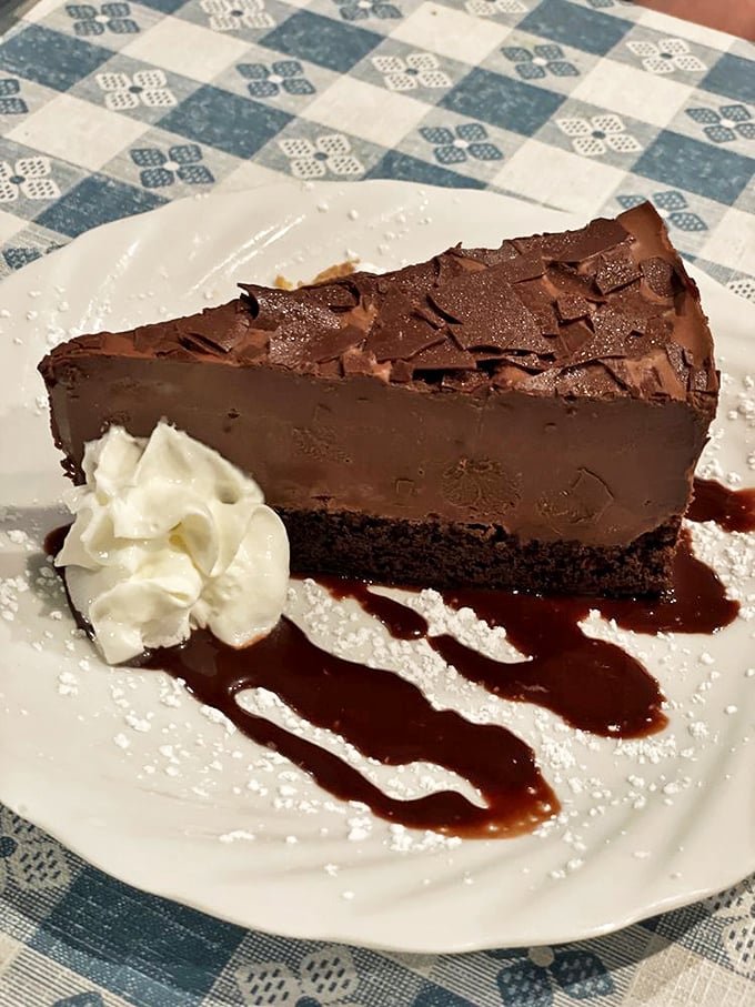 German chocolate cake so rich it probably has its own offshore bank account. That whipped cream is just showing off.