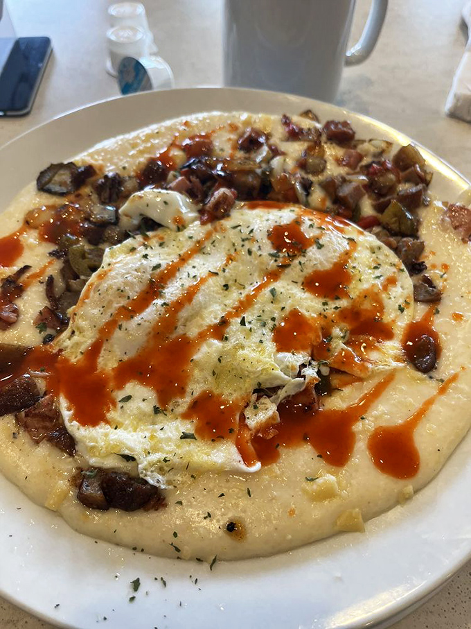 Whoever said grits were boring never met this cheese-laden, bacon-studded masterpiece that's changing Southern breakfast narratives one bite at a time.