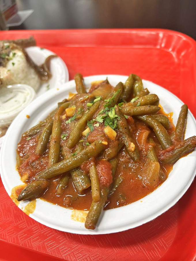 These aren't your cafeteria green beans &ndash; they've slow-danced with tomatoes and herbs until they've become something your vegetable-hating nephew might actually try.