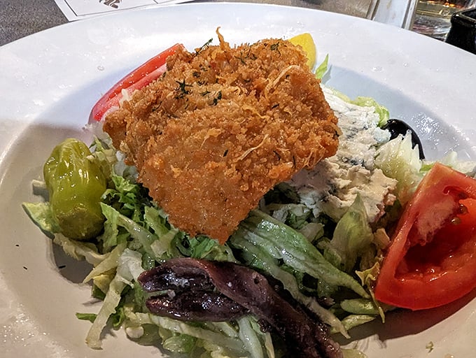 This Greek salad crowned with golden-fried fish is what happens when the Mediterranean meets the Deep South.