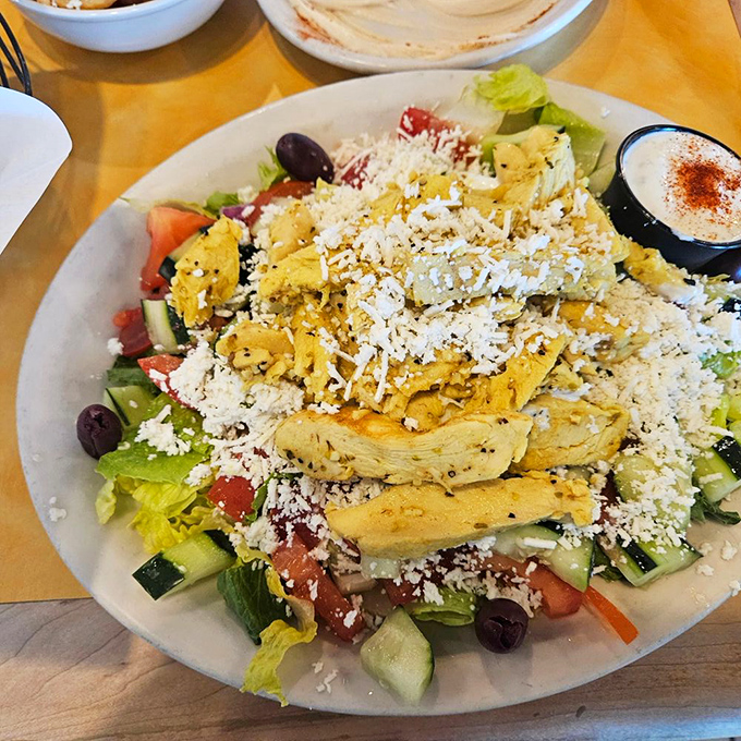 A Greek salad that actually respects the vegetables. Crisp, colorful, and crowned with grilled chicken that makes "just a salad" feel like a feast.