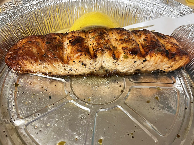 This salmon didn't just get grilled; it got a Mediterranean spa treatment of lemon, herbs, and olive oil.