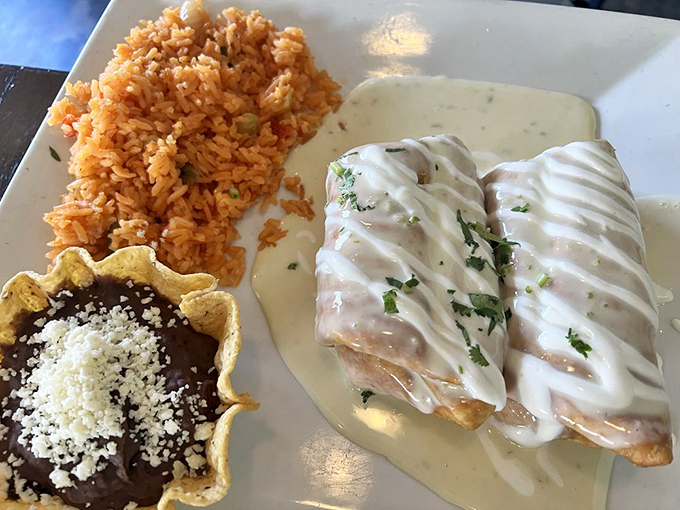 If comfort food wore formal attire, it would look exactly like this: a dressed-up chimichanga in its elegant cream sauce, ready for its close-up.